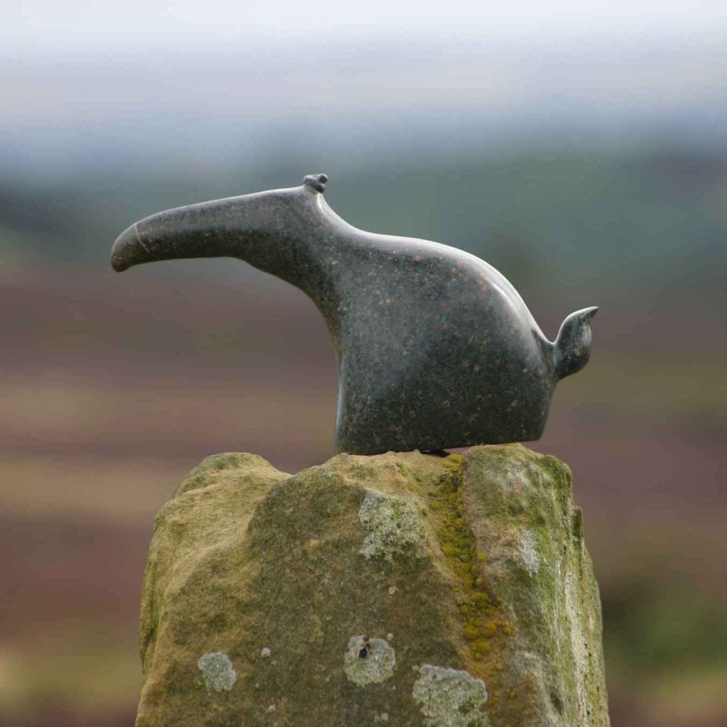 Bird stone sculpture