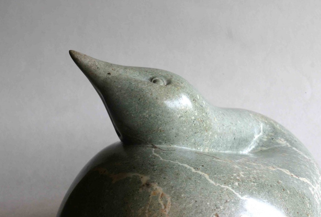 Sculpture of a Diver preening, carved in Serpentine stone