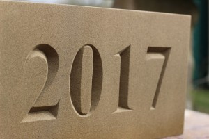 A date stone 2017 carved with incised lettering in Yorkstone